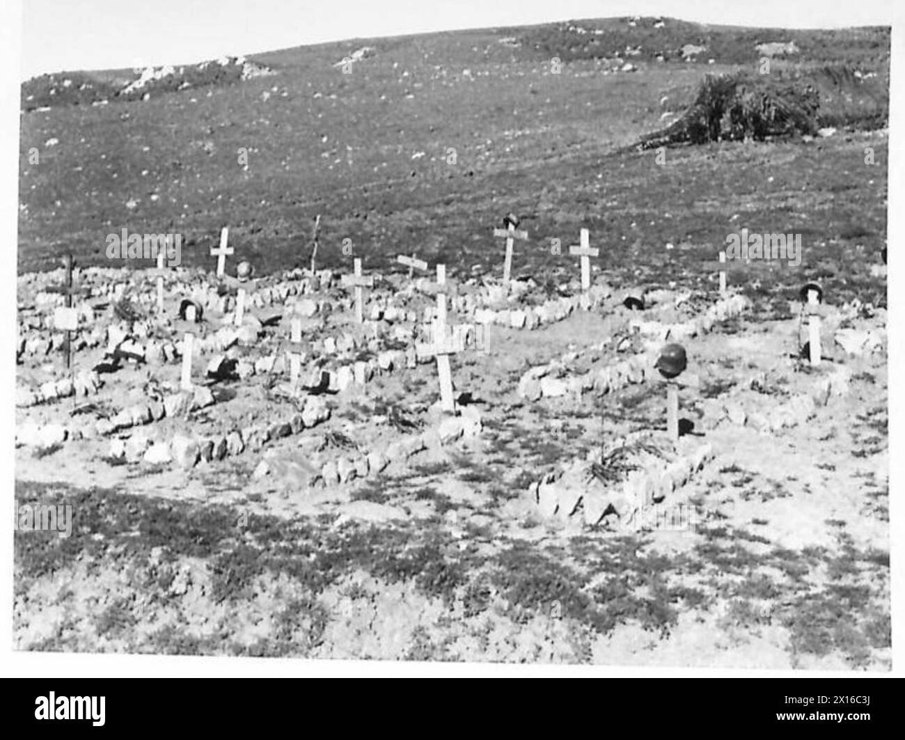First Army soldiers bury enemy dead at Toukabeur, erecting crosses with ...