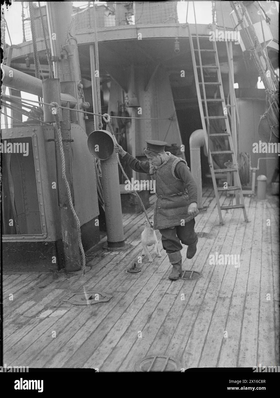 A crew member of HMT Stella Pegasi at Scapa Flow grips the lifeline ...