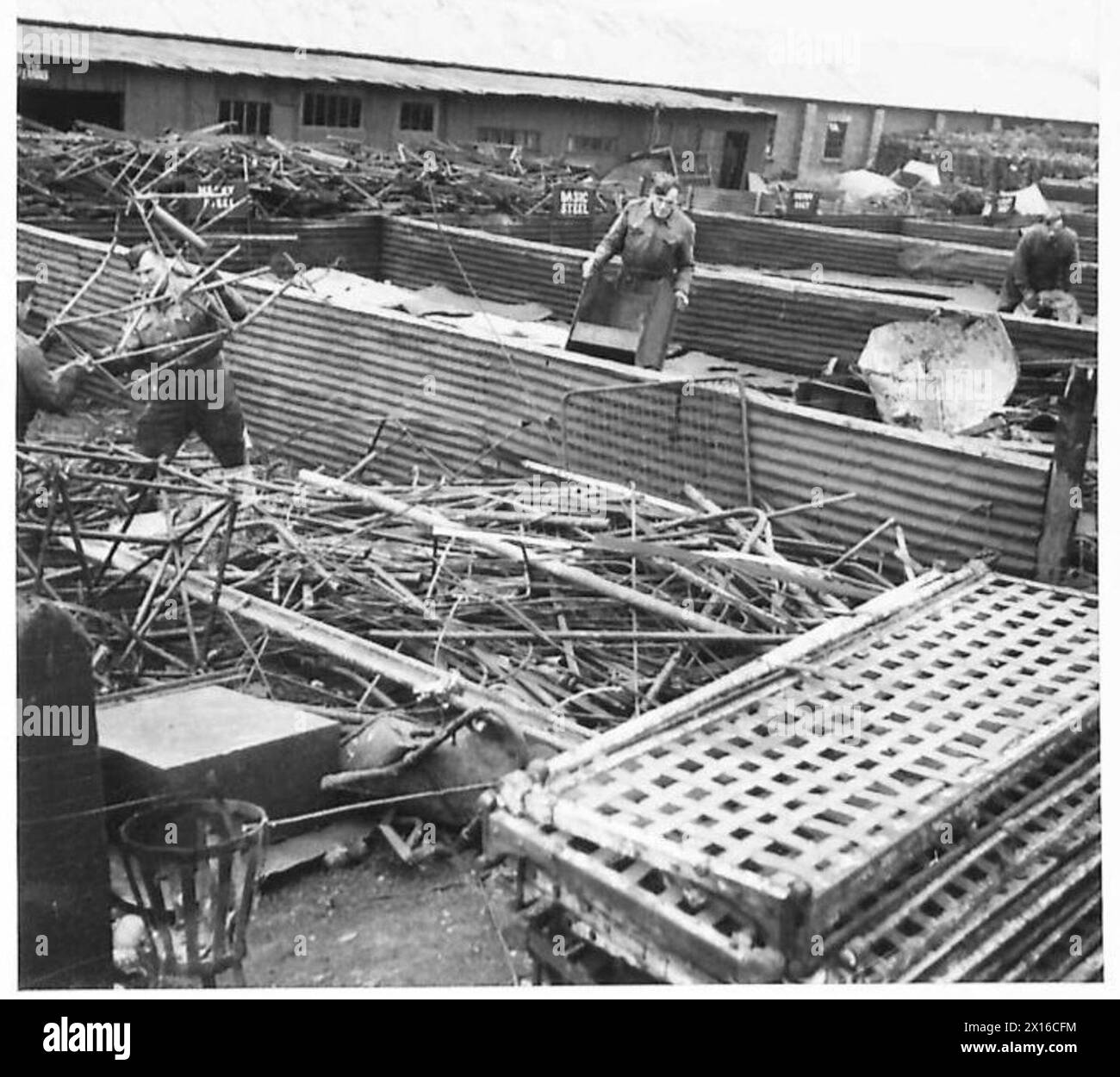 AT A NORTHERN IRELAND ARMY SALVAGE DEPOT - Sorting the heavier scrap ...