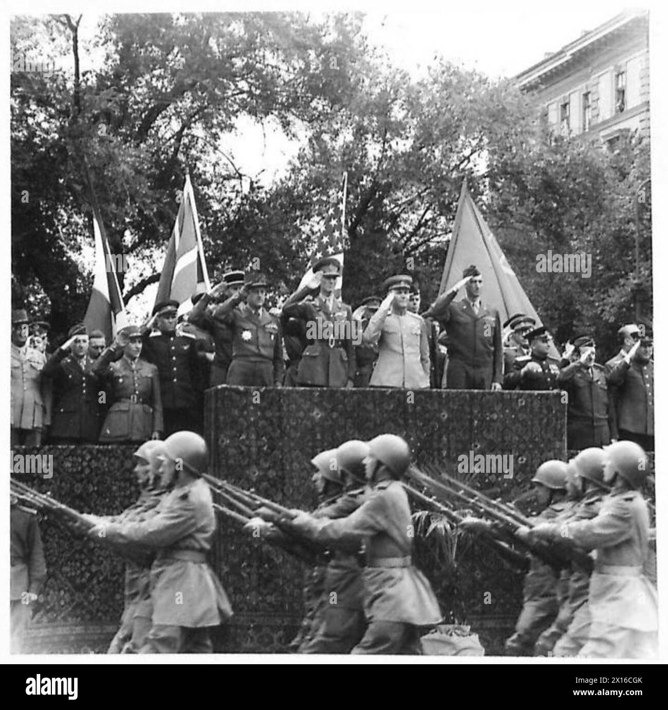 Russian troops march past a saluting base in Vienna during a parade ...