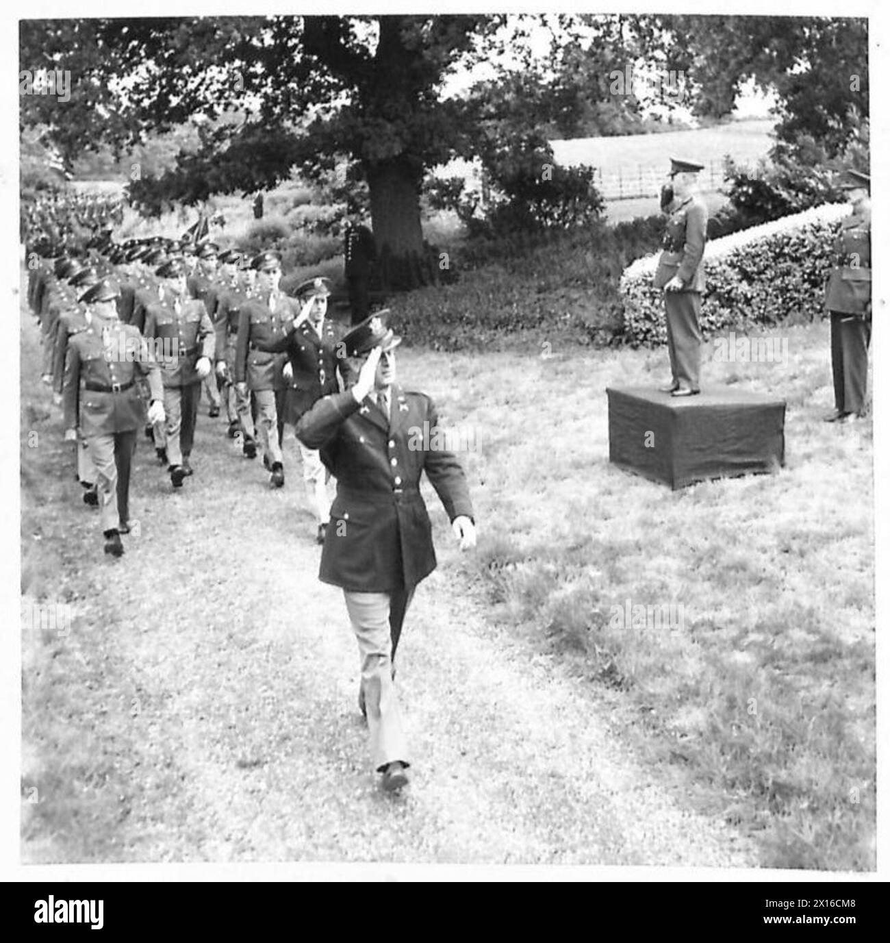 A company of American soldiers pass the saluting base at Bushey Heath ...