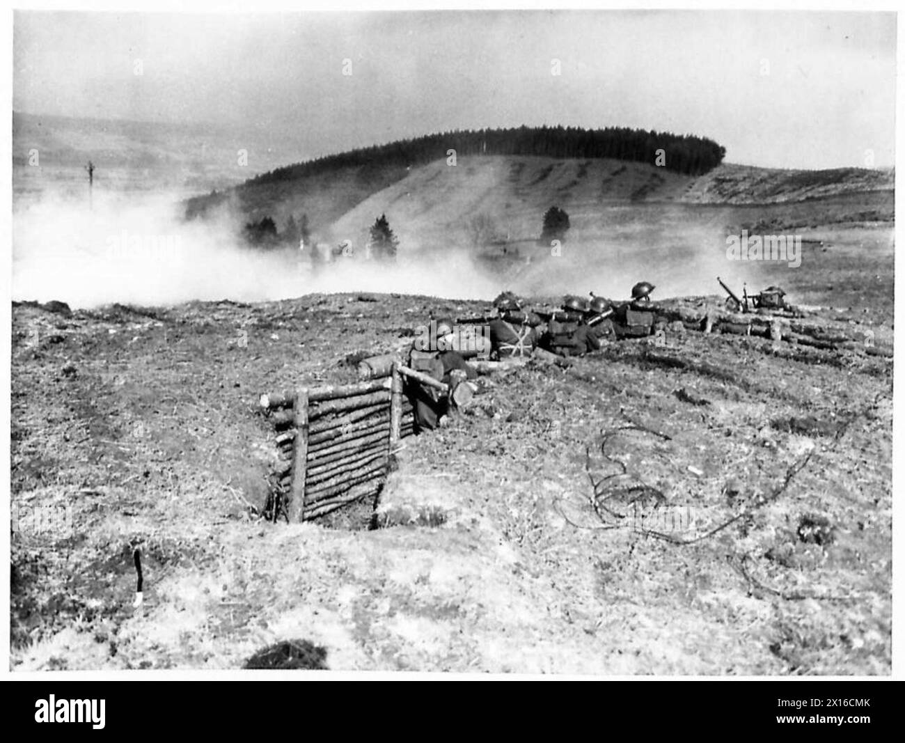 TOUGHENING-UP EXERCISE IN SOUTH WALES - Troops in a trench repelling an ...