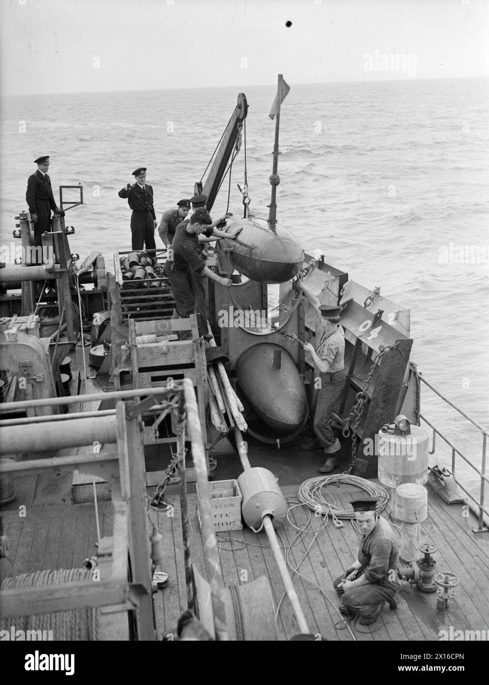 MINESWEEPERS HARD AT WORK TO MAKE SEAS SAFE AGAIN. JULY 1945, ON BOARD ...