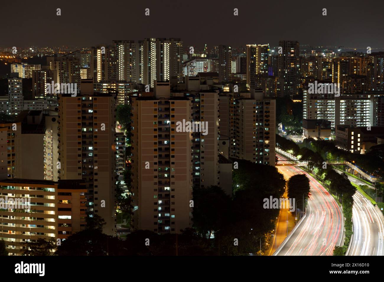 Aerial view by night of the toll road running through the condominiums ...