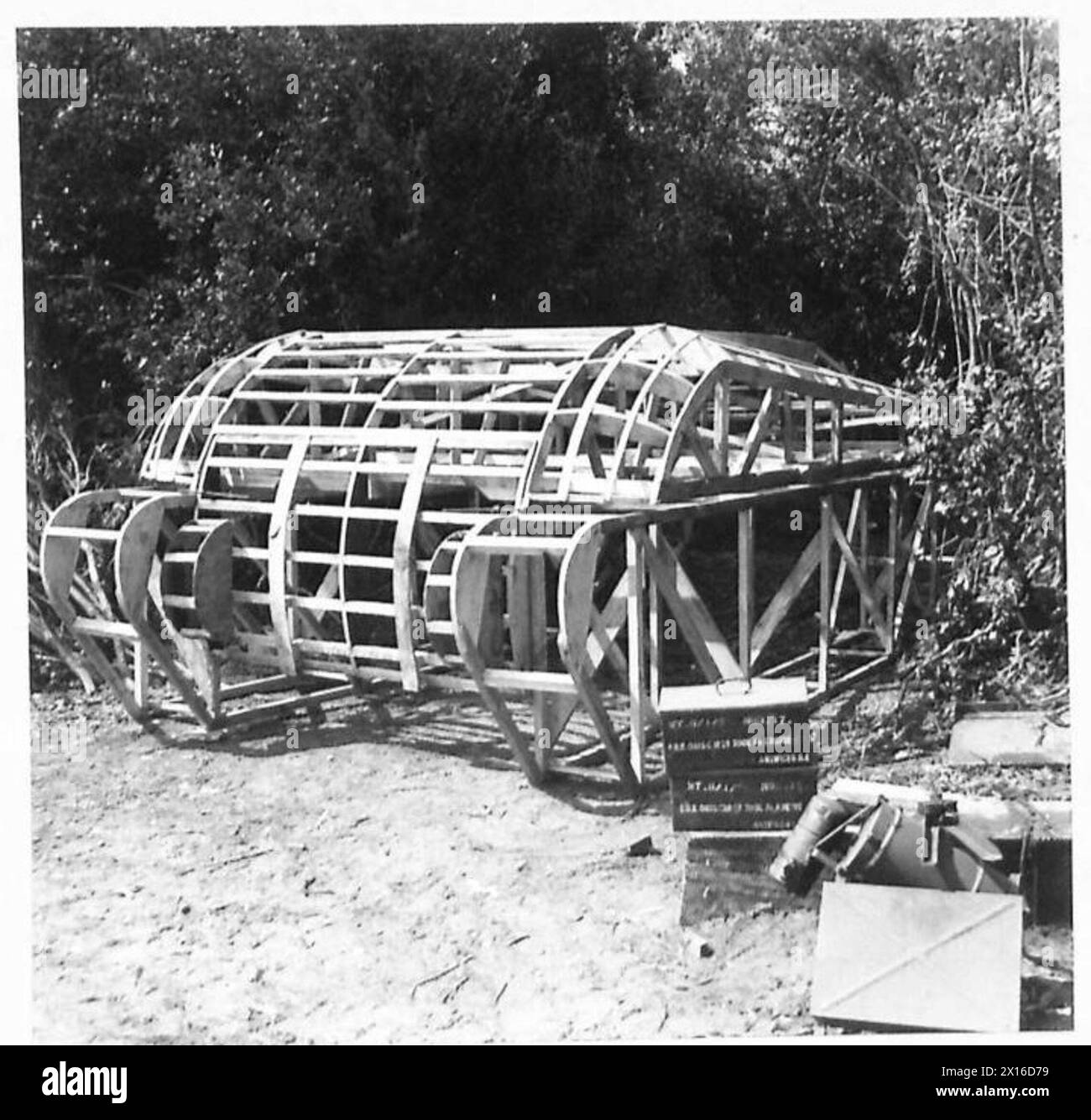 A dummy Sherman tank is shown under construction in a three-quarter ...