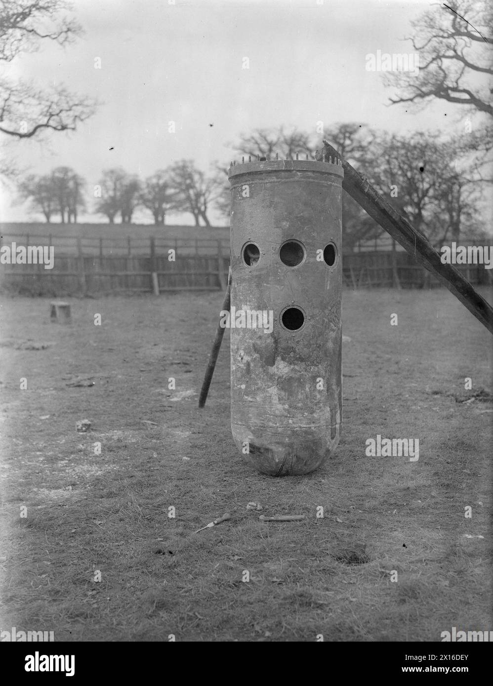 A parachute mine is prepared for disposal, demonstrating naval bomb ...