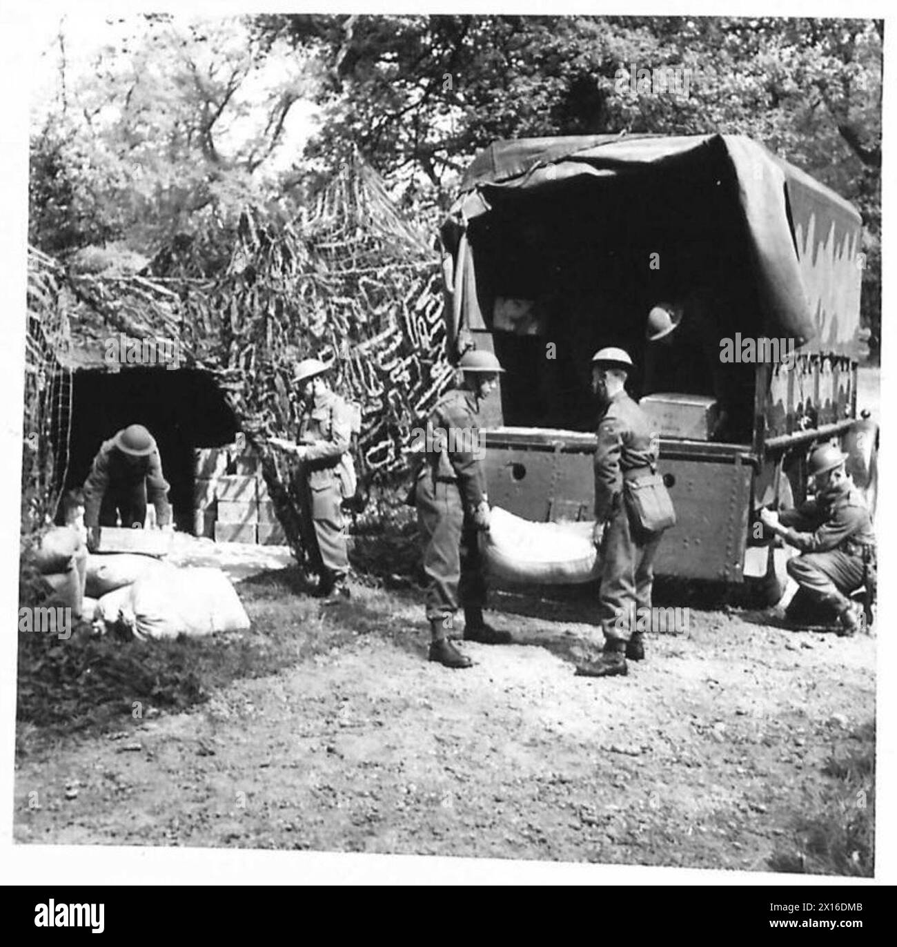 Food supplies are being loaded onto lorries by the Royal Army Service ...