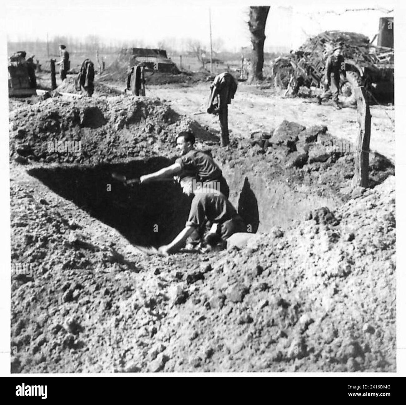 British Army troops of the 21st Army Group dig defensive positions and ...