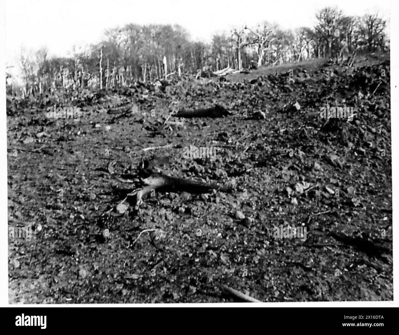 AMMUNITION DUMP EXPLODES - These pictures show the crater and debris ...