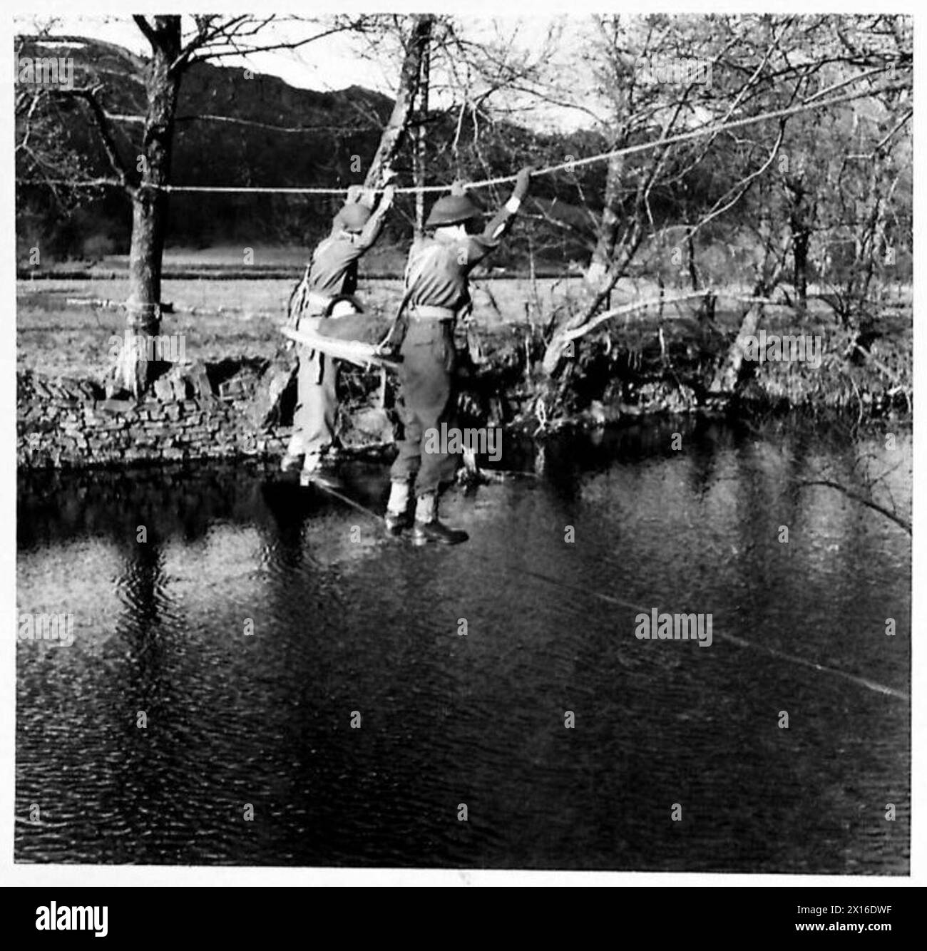 A FIELD AMBULANCE UNIT IN BATTLE TRAINING - A "wounded man" is conveyed ...