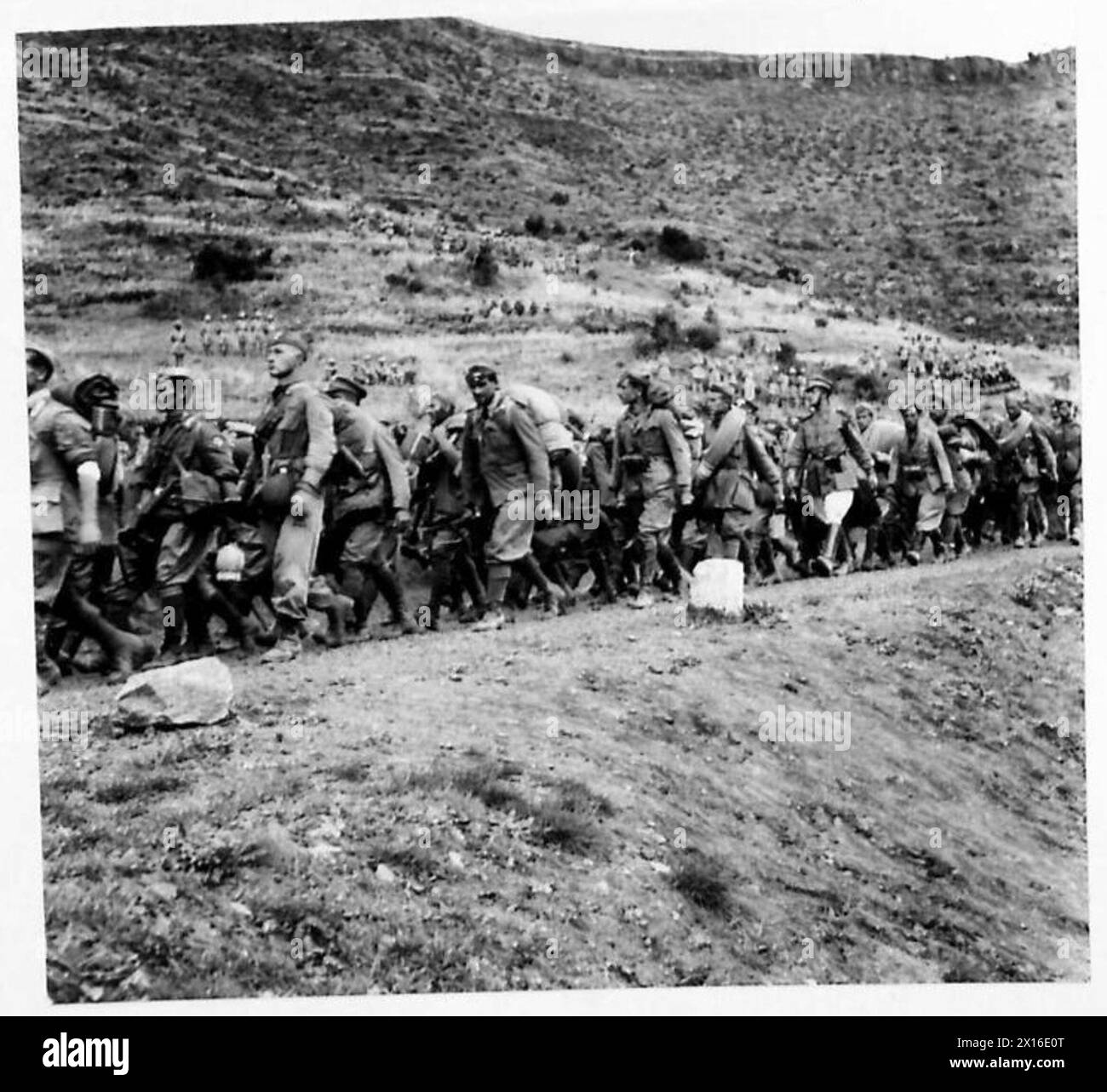 Italian prisoners march down a mountainside after surrendering Fort ...