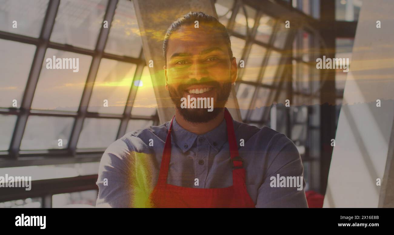 Image of landscape over biracial male barista Stock Photo - Alamy
