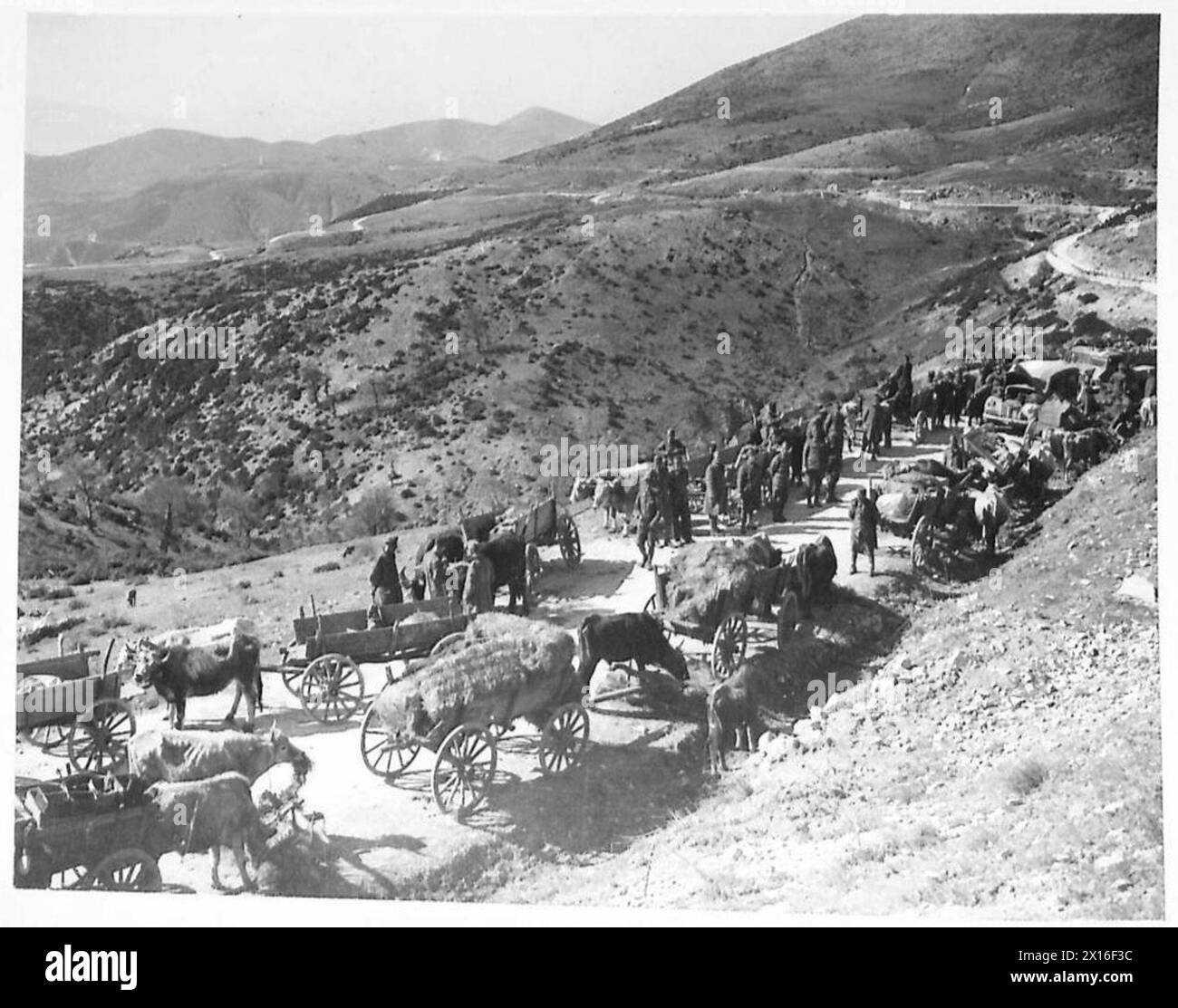 Greek transport vehicles are seen on a mountain road as British troops ...