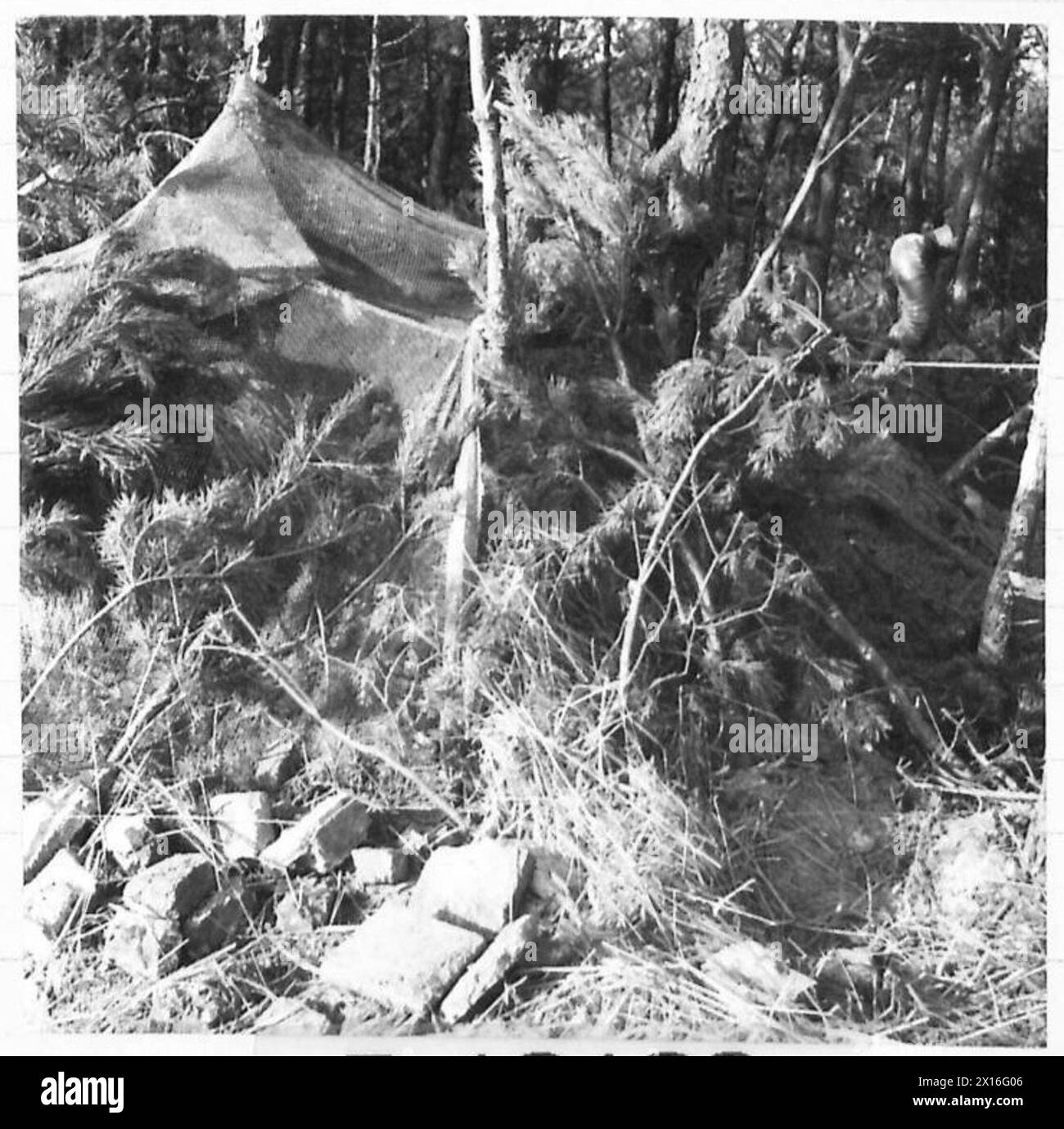 Infantry positions near the River Maas include a camouflaged soldier's ...