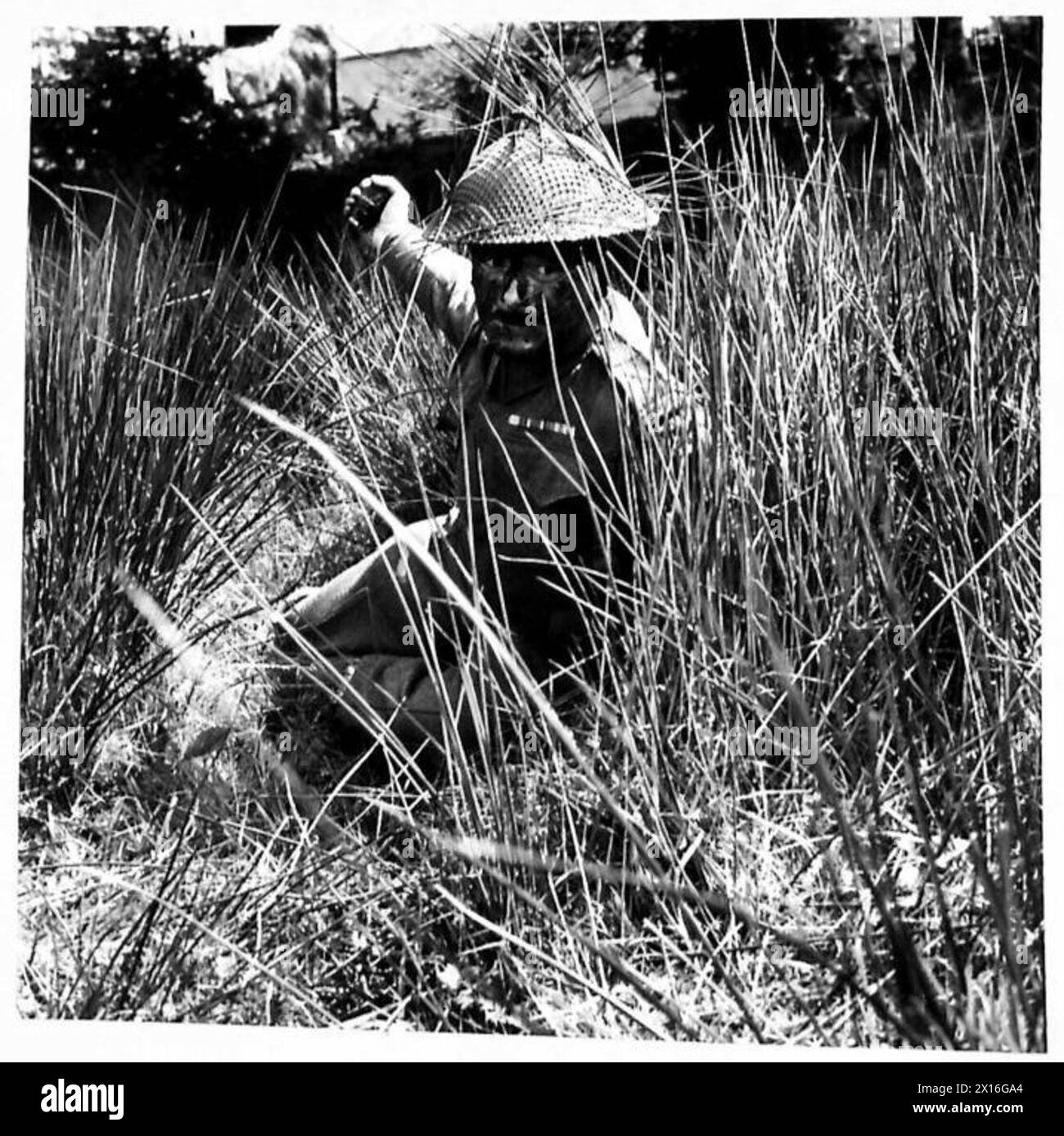 THE ART OF CAMOUFLAGE - With blackened face and under cover of rushes ...