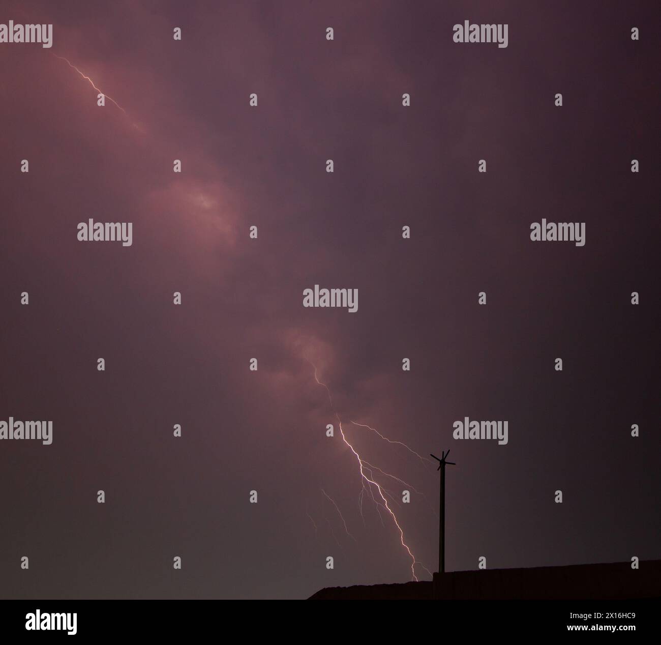A night sky view with huge thunder and lightning strike in a stormy ...
