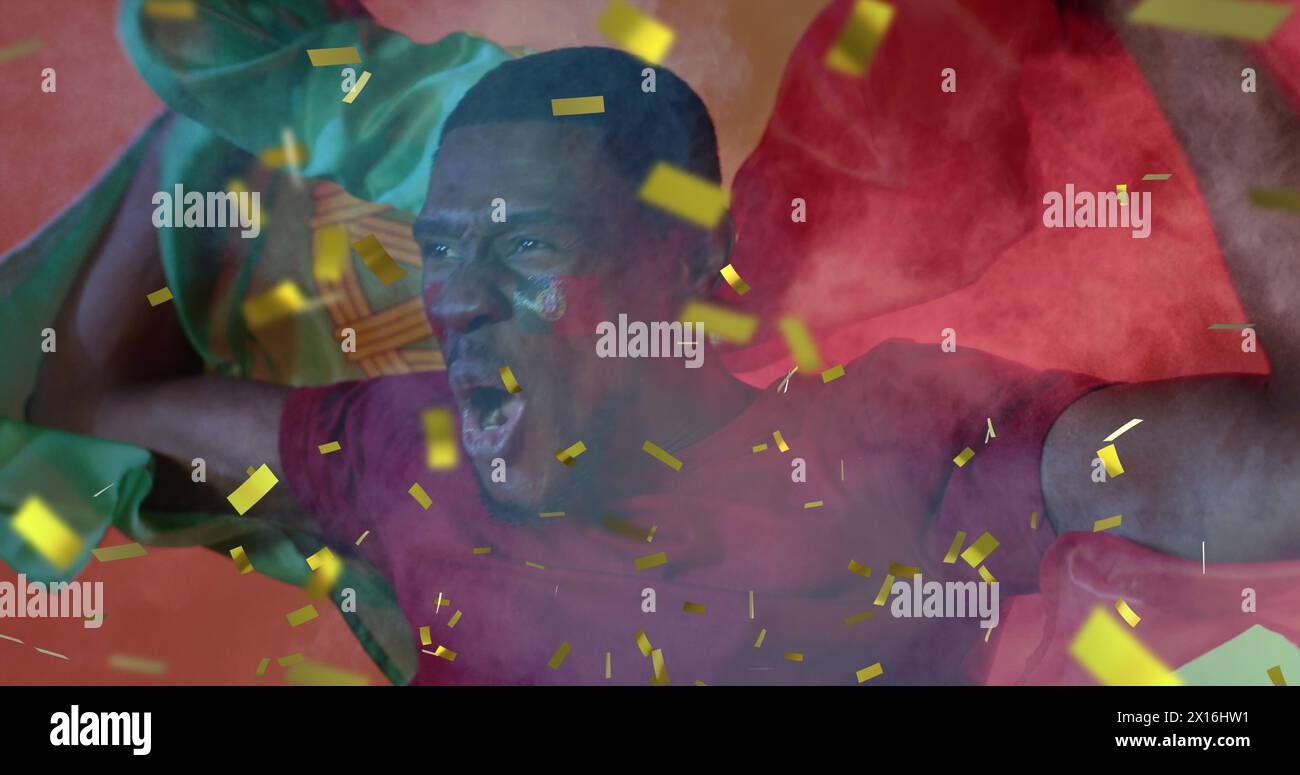 Image of gold confetti over cheering african american male sports fan ...