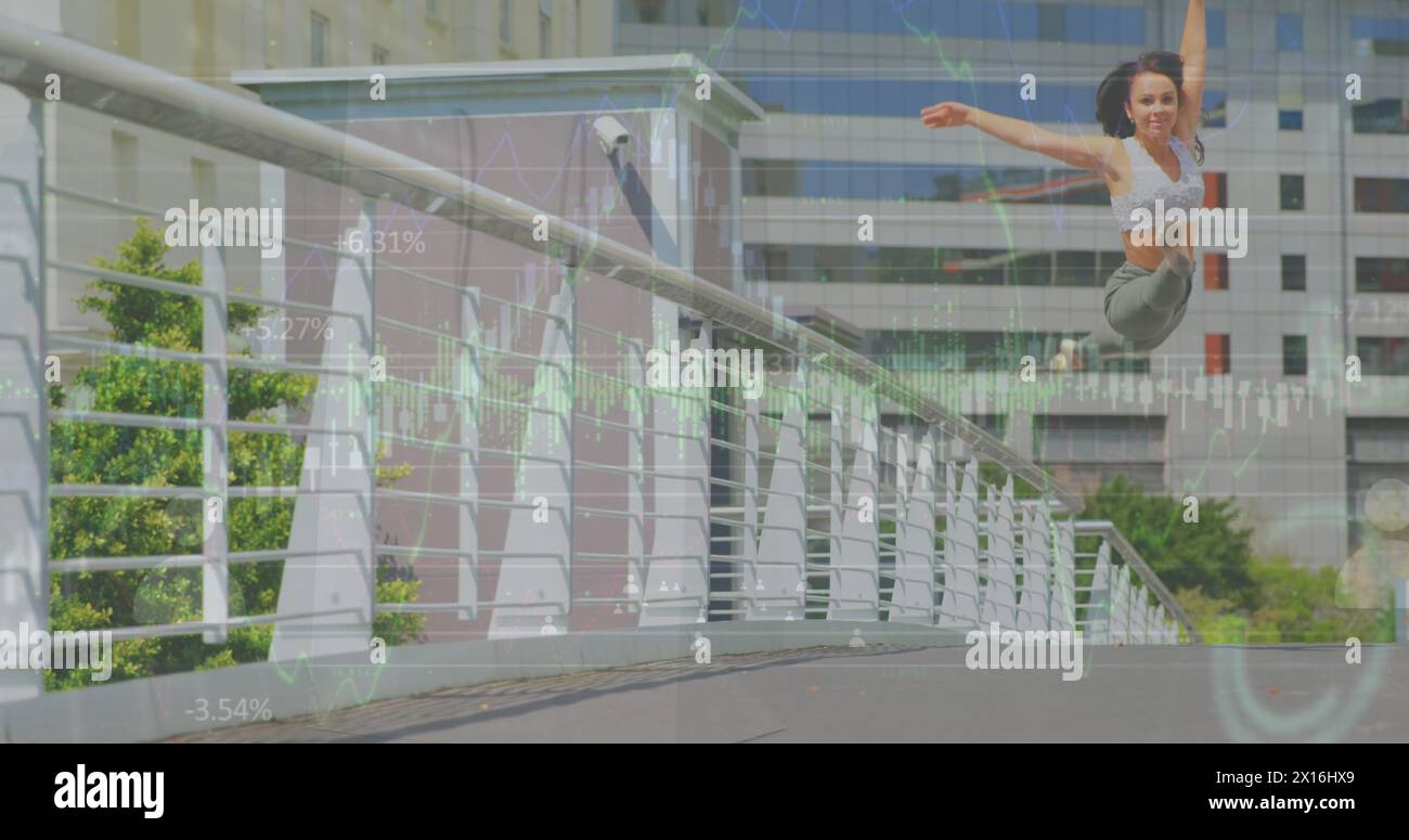Image of graphs and people icons over caucasian young woman jumping ...