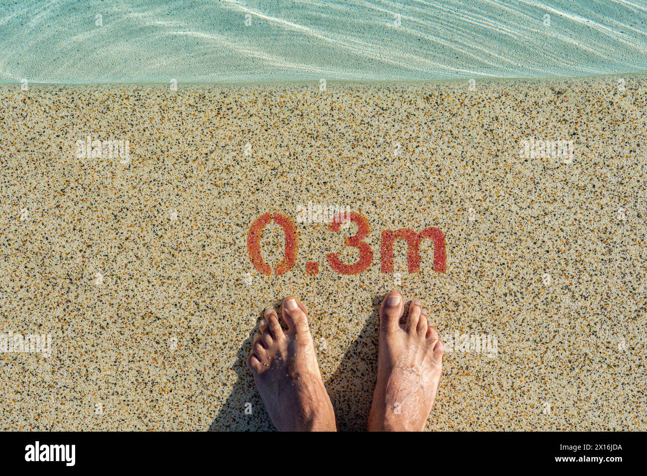 two feet at the pool entrance with a depth indication of 0.3 meters ...