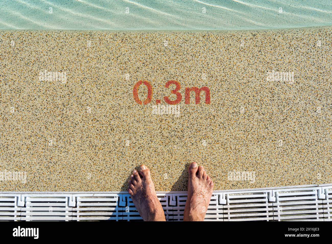 two feet at the pool entrance with a depth indication of 0.3 meters ...