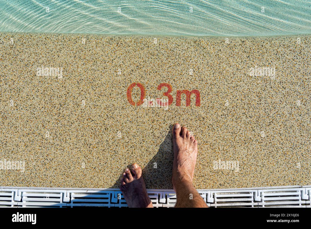 two feet at the pool entrance with a depth indication of 0.3 meters ...