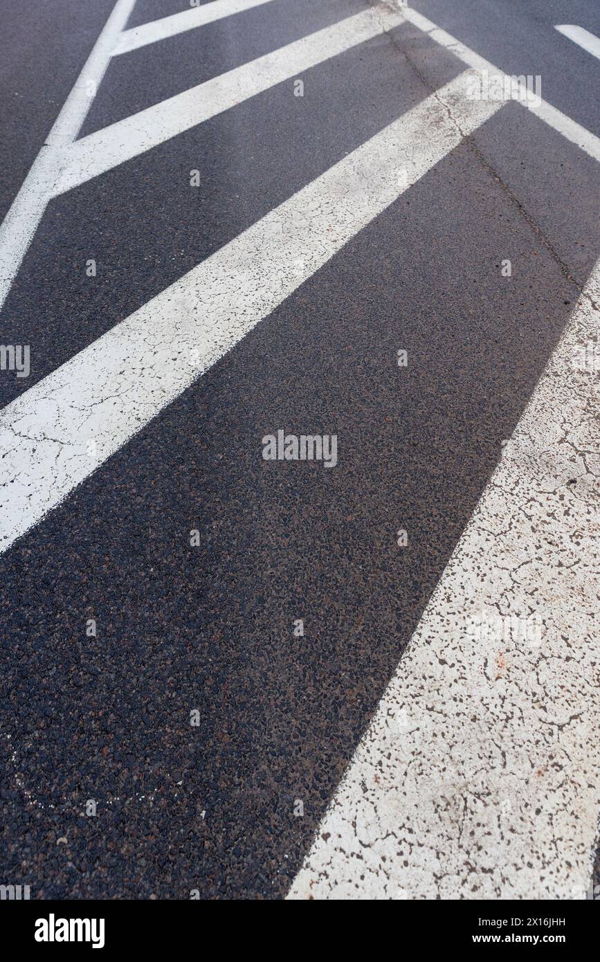 old road markings on the highway in winter, old paved road with white ...