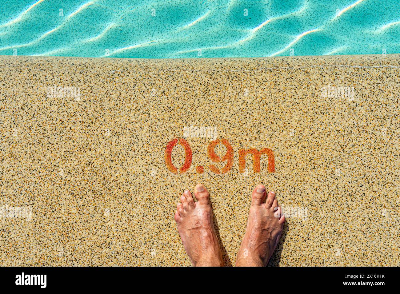 two feet at the pool entrance with a depth indication of 0.9 meters ...