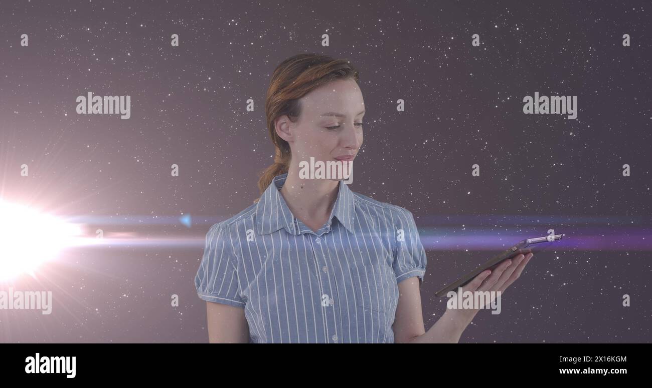 Image of happy caucasian businesswoman using tablet over night sky with ...