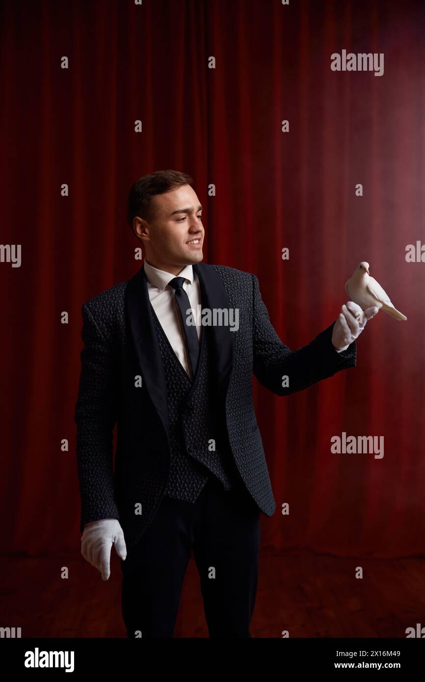Male magician white pigeon hi-res stock photography and images - Alamy