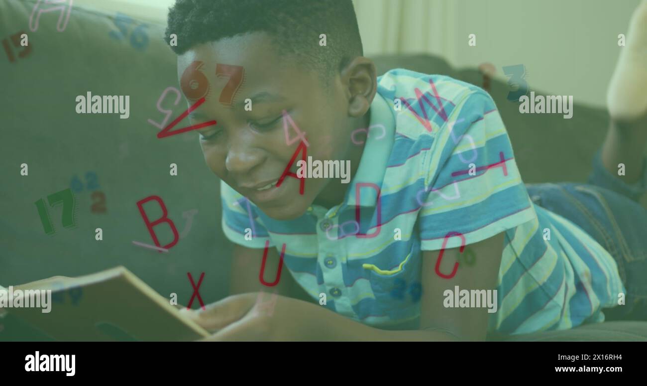 Image of letters and numbers over african american boy reading Stock ...