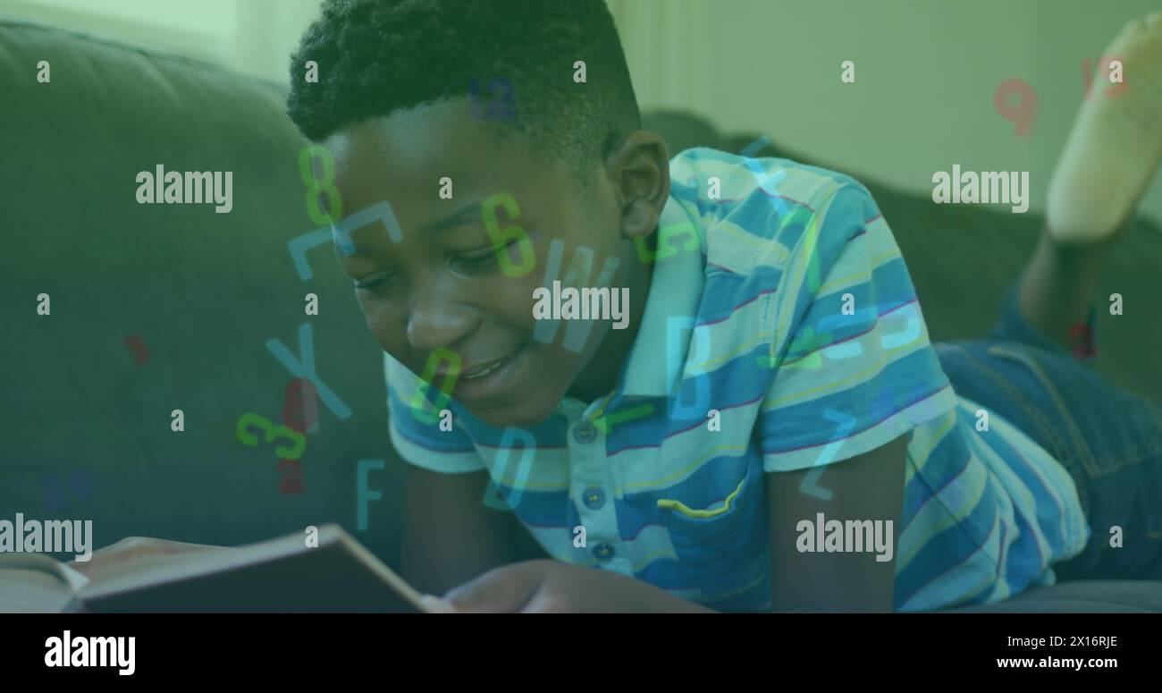 Image of letters and numbers over african american boy reading Stock ...