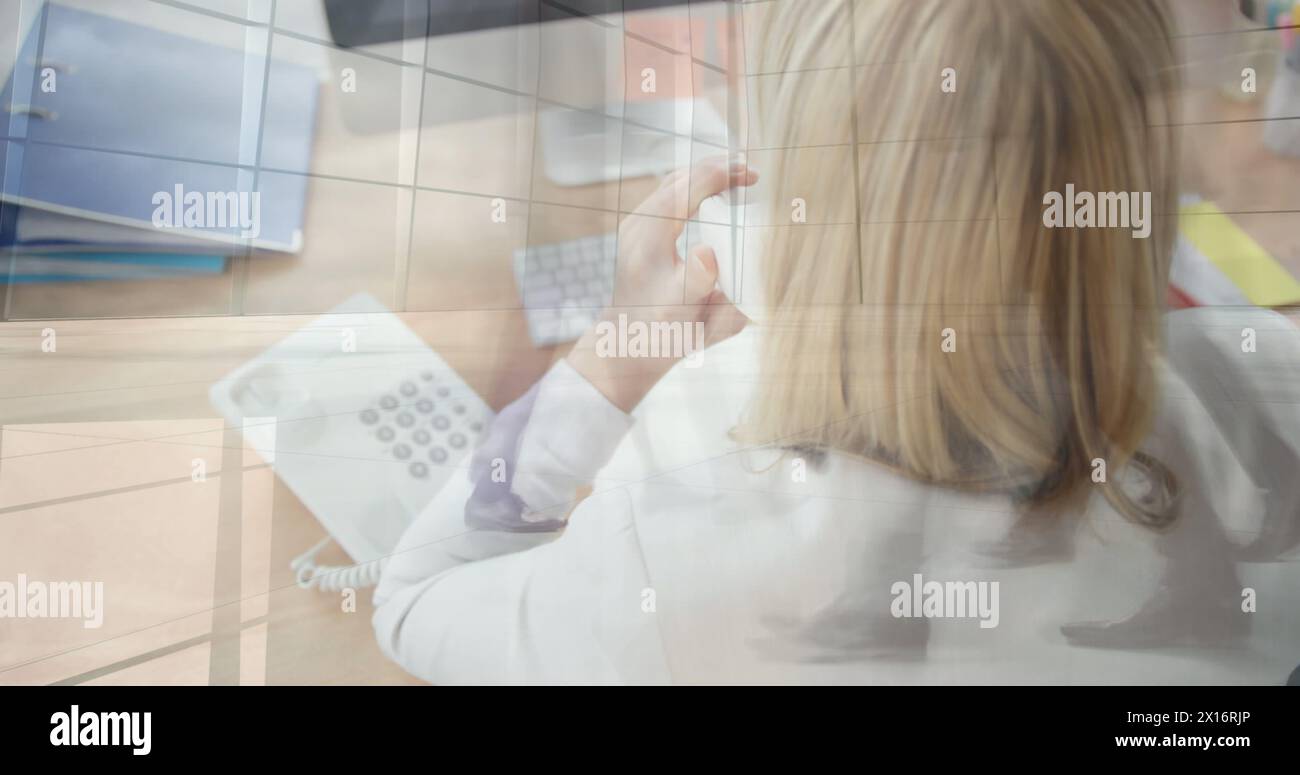 Image of caucasian businesswoman using computer over people walking ...
