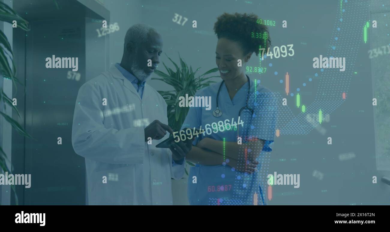 Image of numbers and data processing over diverse doctors using tablet ...