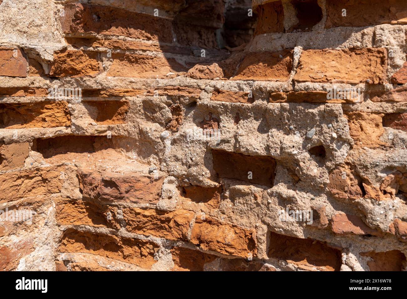 red brick ruins , damaged red bricks from the wall of an ancient ...