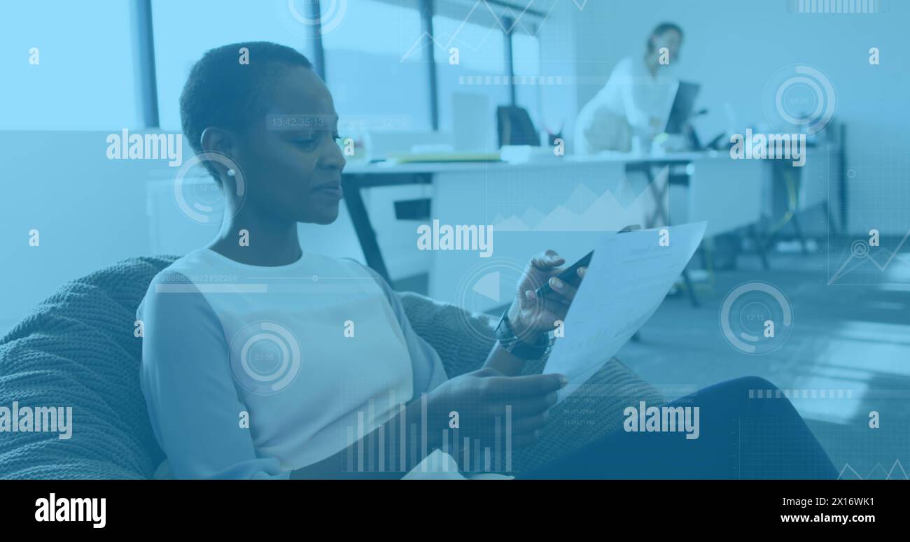 Image of data processing over african american woman taking on ...