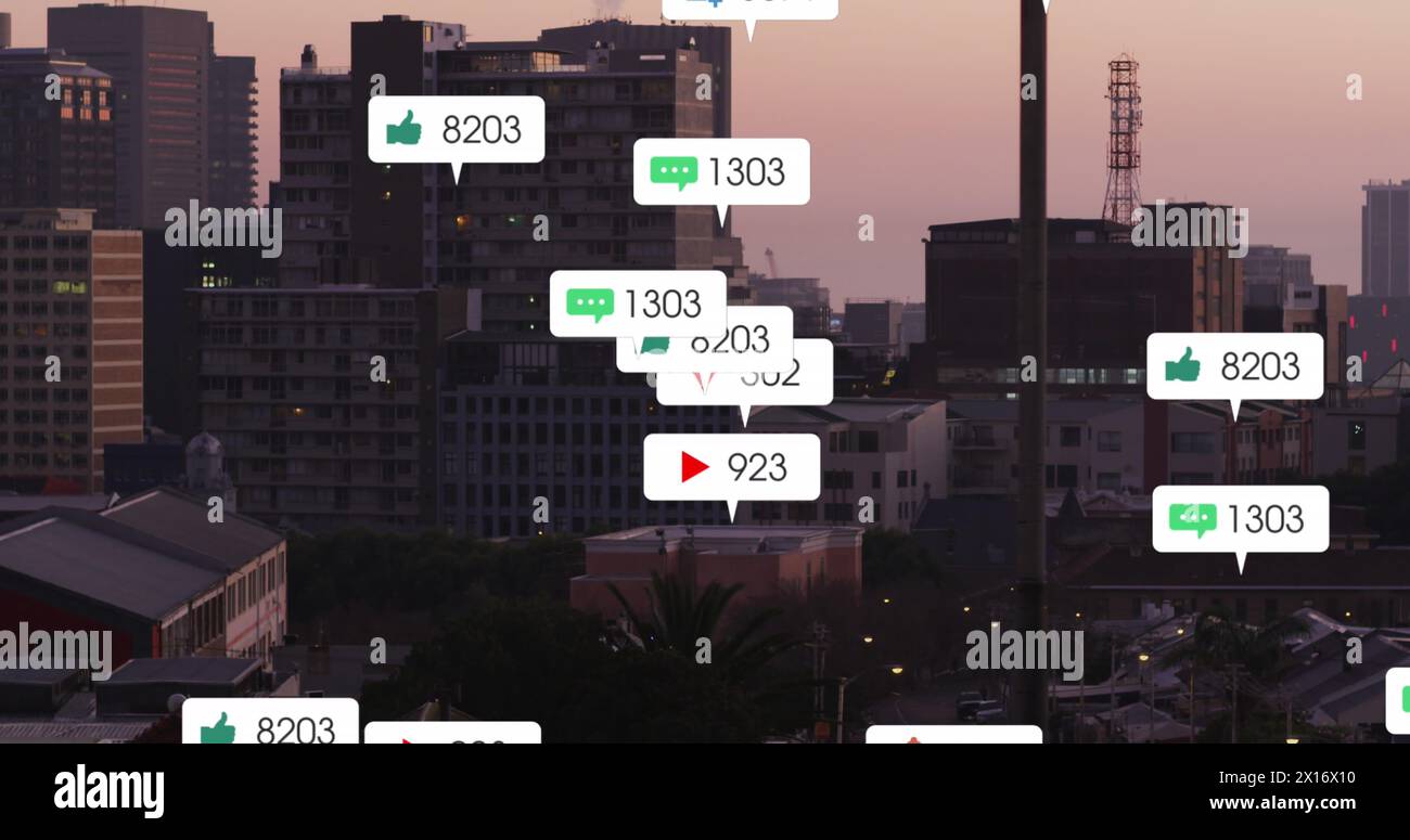 Image of social media icons falling against aerial view of cityscape ...