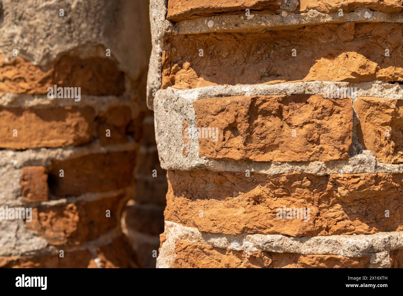 red brick ruins , damaged red bricks from the wall of an ancient ...