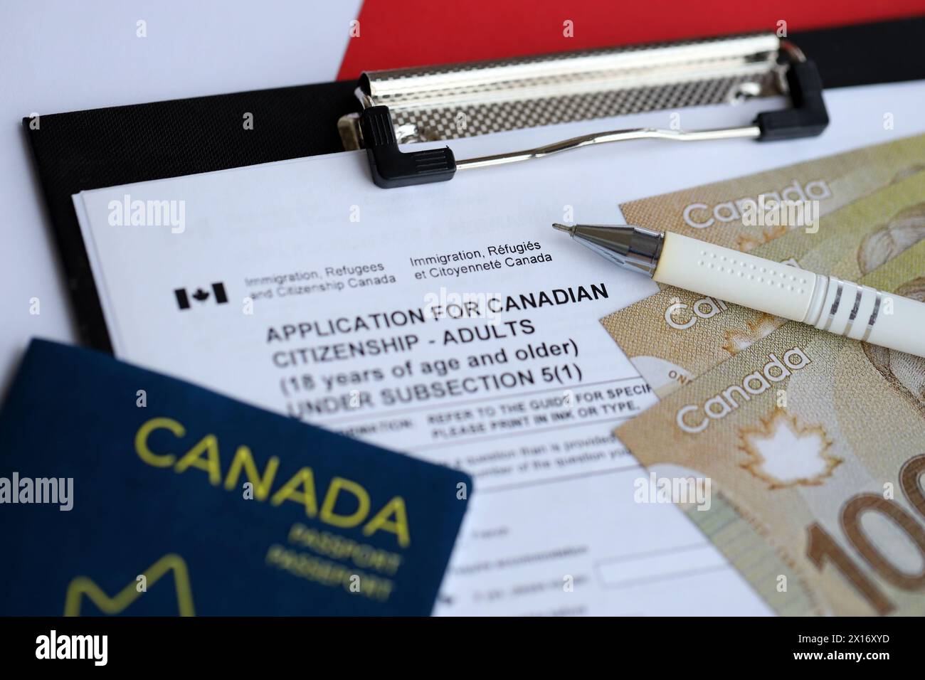 Application for Canadian citizenship for adults on table with pen ...