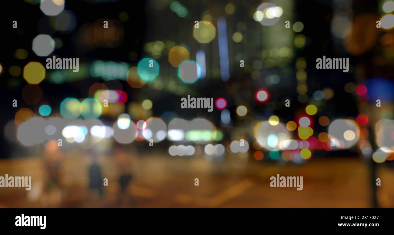 Image of road traffic in city at night with blurred city lights and ...