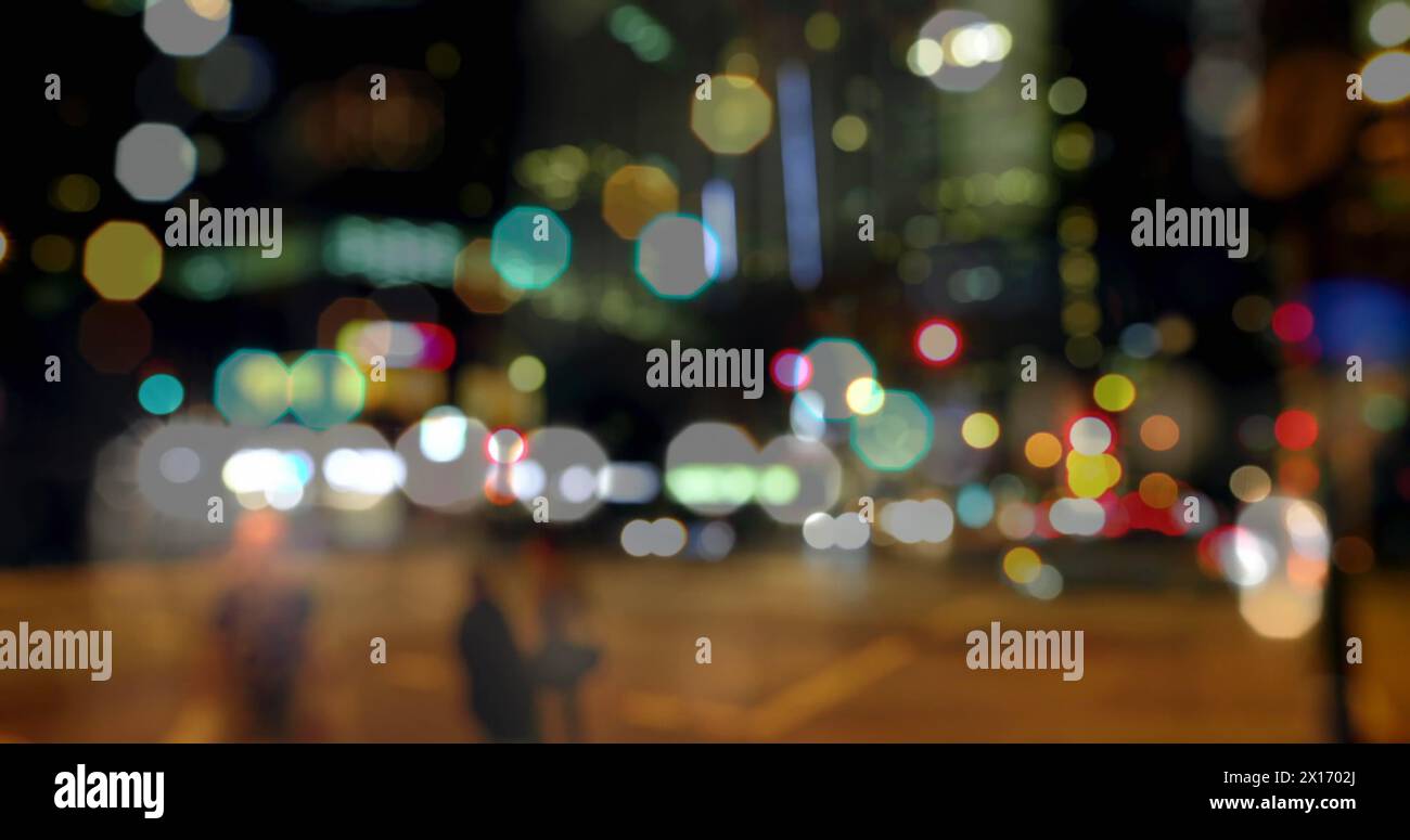 Image of road traffic in city at night with blurred city lights and ...