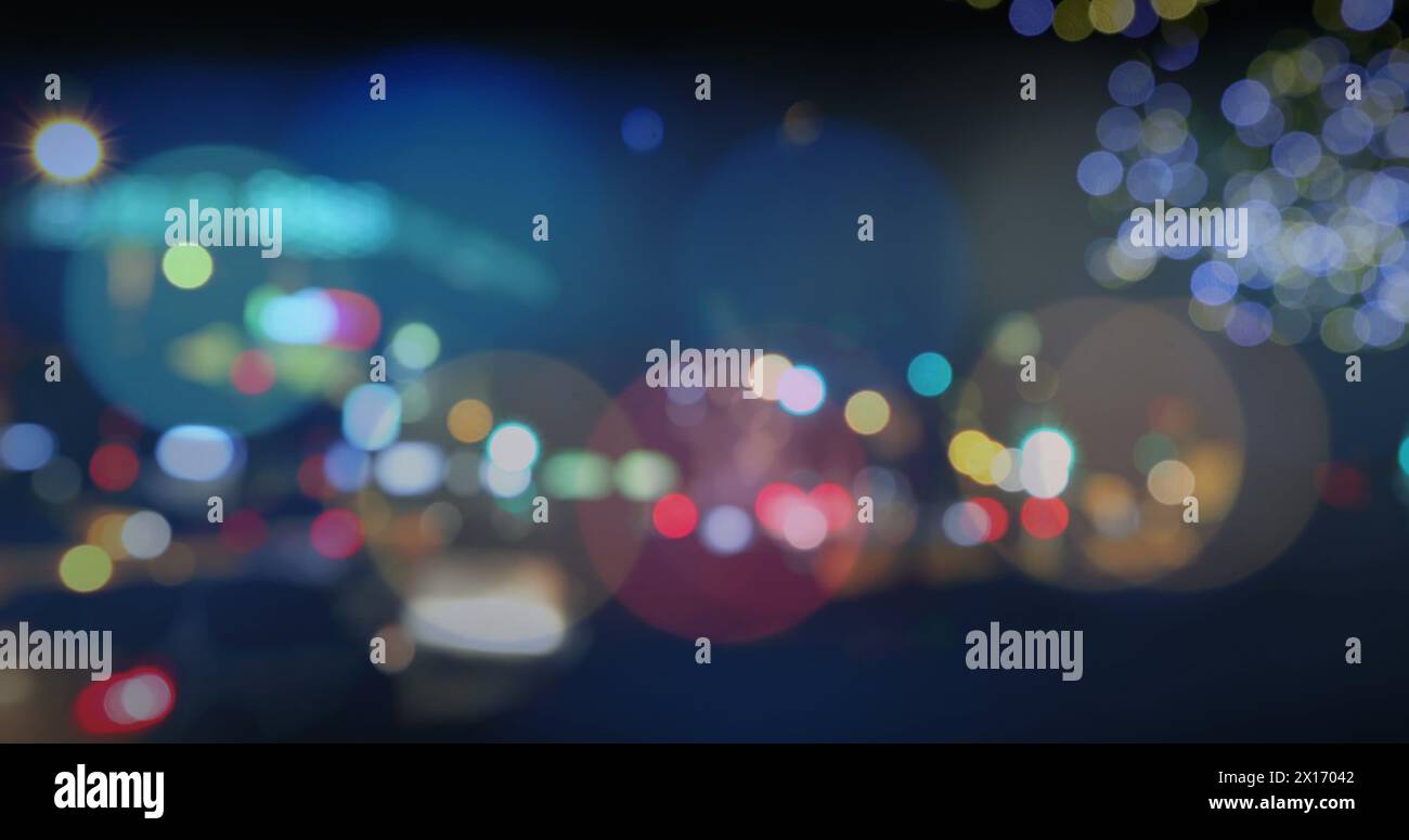 Image of road traffic in city at night with blurred city lights and ...