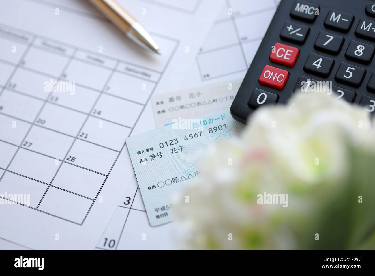 Japanese my number card specimen and notification card on calendar ...