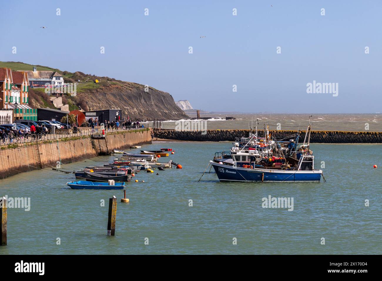 The outer harbour at Folkestone with the White Cliffs of Dover in the ...
