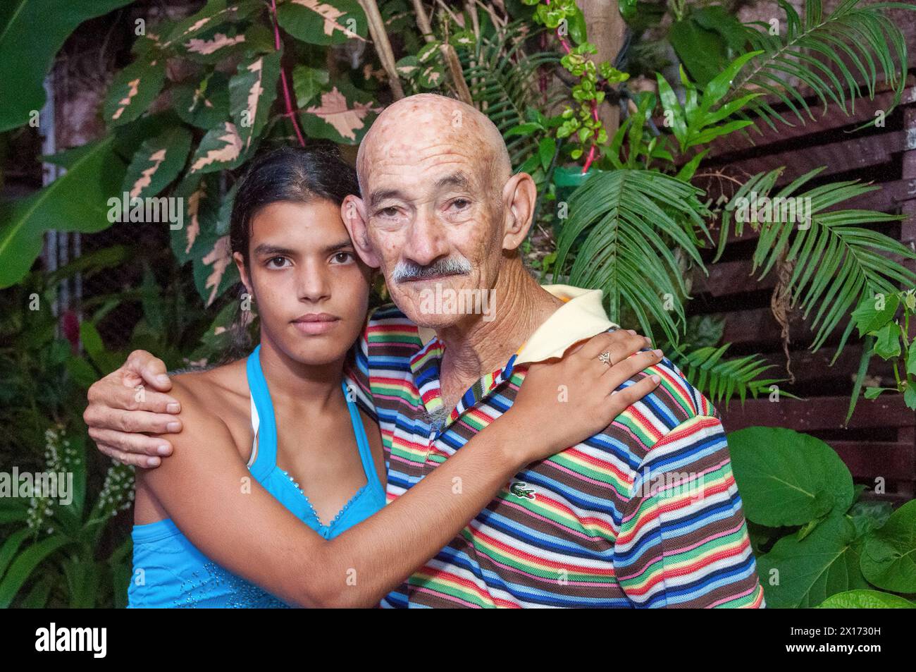 Granfather and granddaughter. Portrait of real Cuban people Stock Photo ...