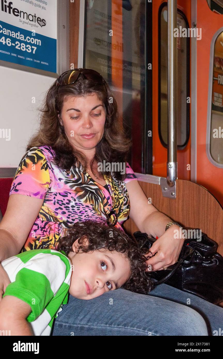 Mother and son in TTC subway train. Portrait of real Cuban people Stock ...