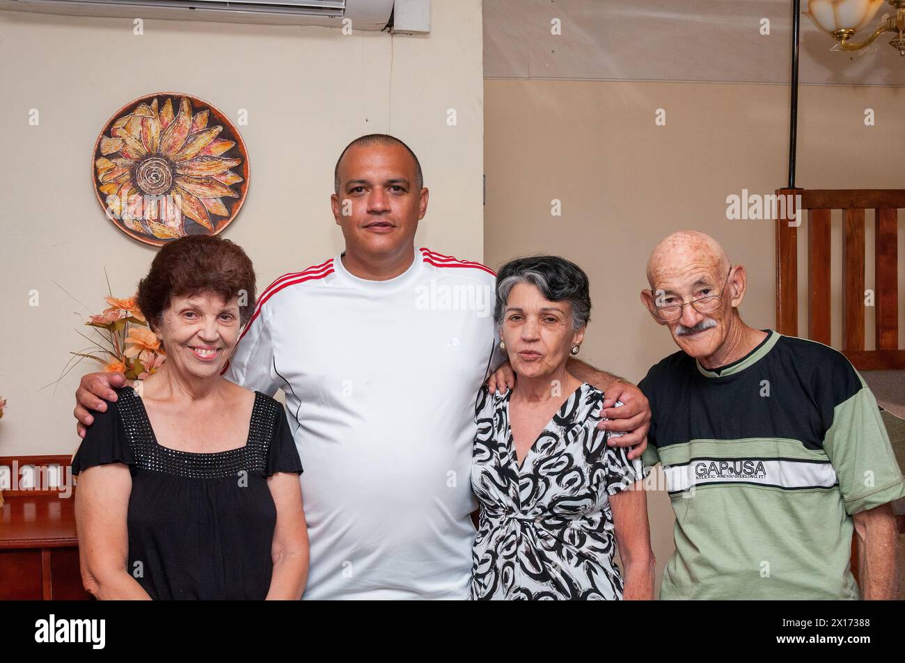 Family together in restaurant. Portrait of real Cuban people. Mother ...
