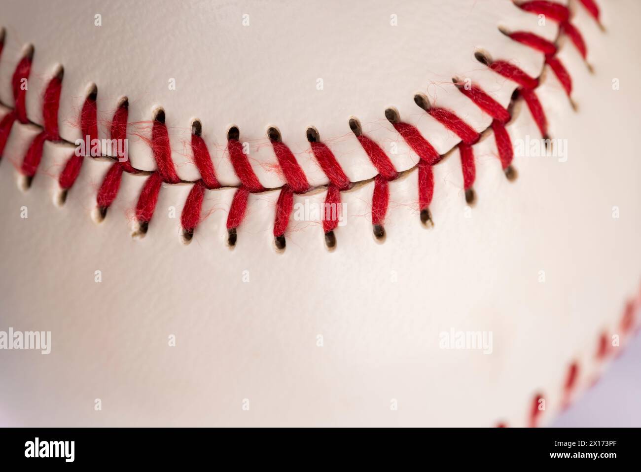 white baseball ball tied with red thread, a real round baseball ball ...