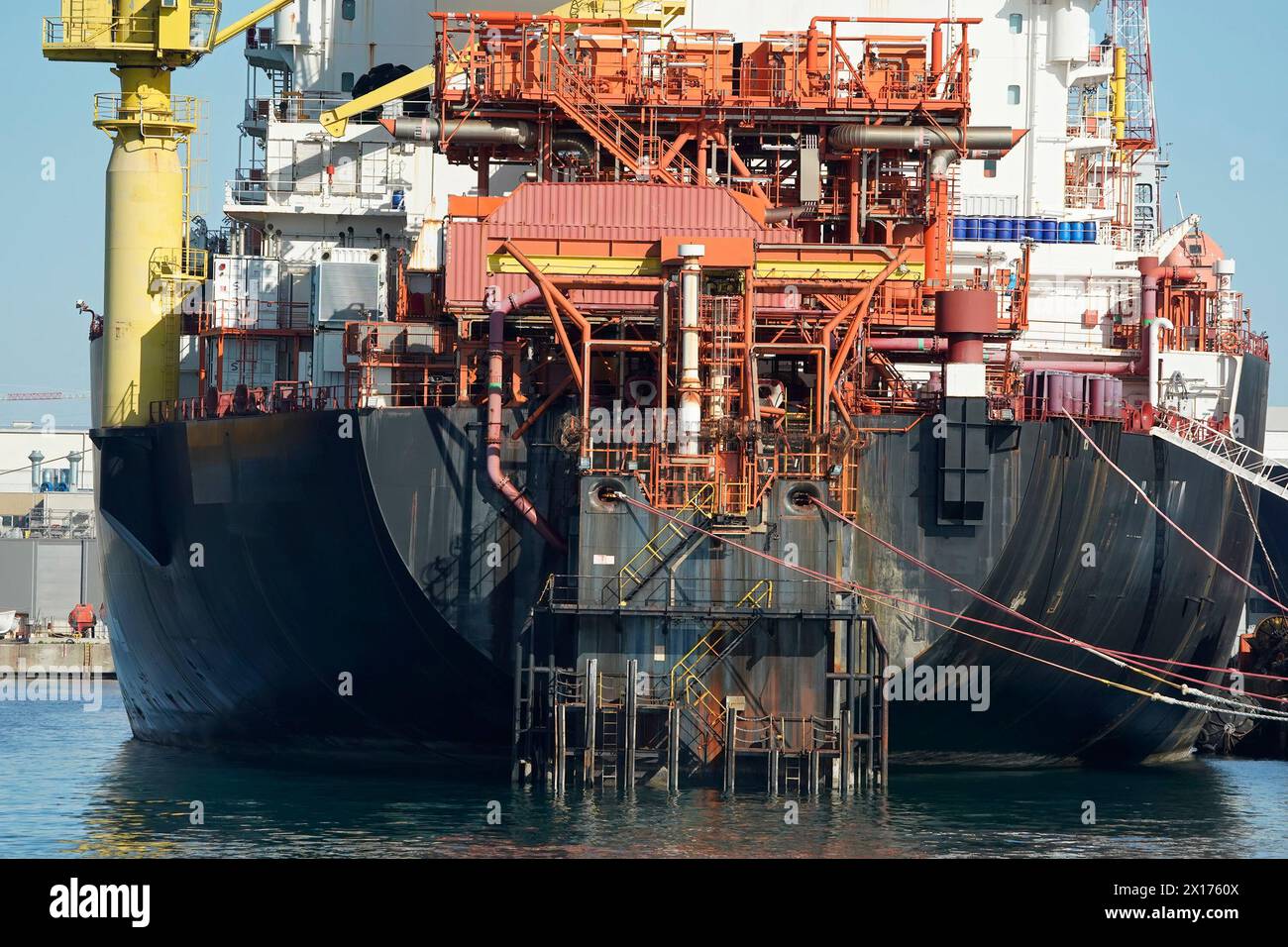 A regasifier ship LNG Liquified Natural Gas tanker anchored in Genoa Harbor, Italy Stock Photo ...