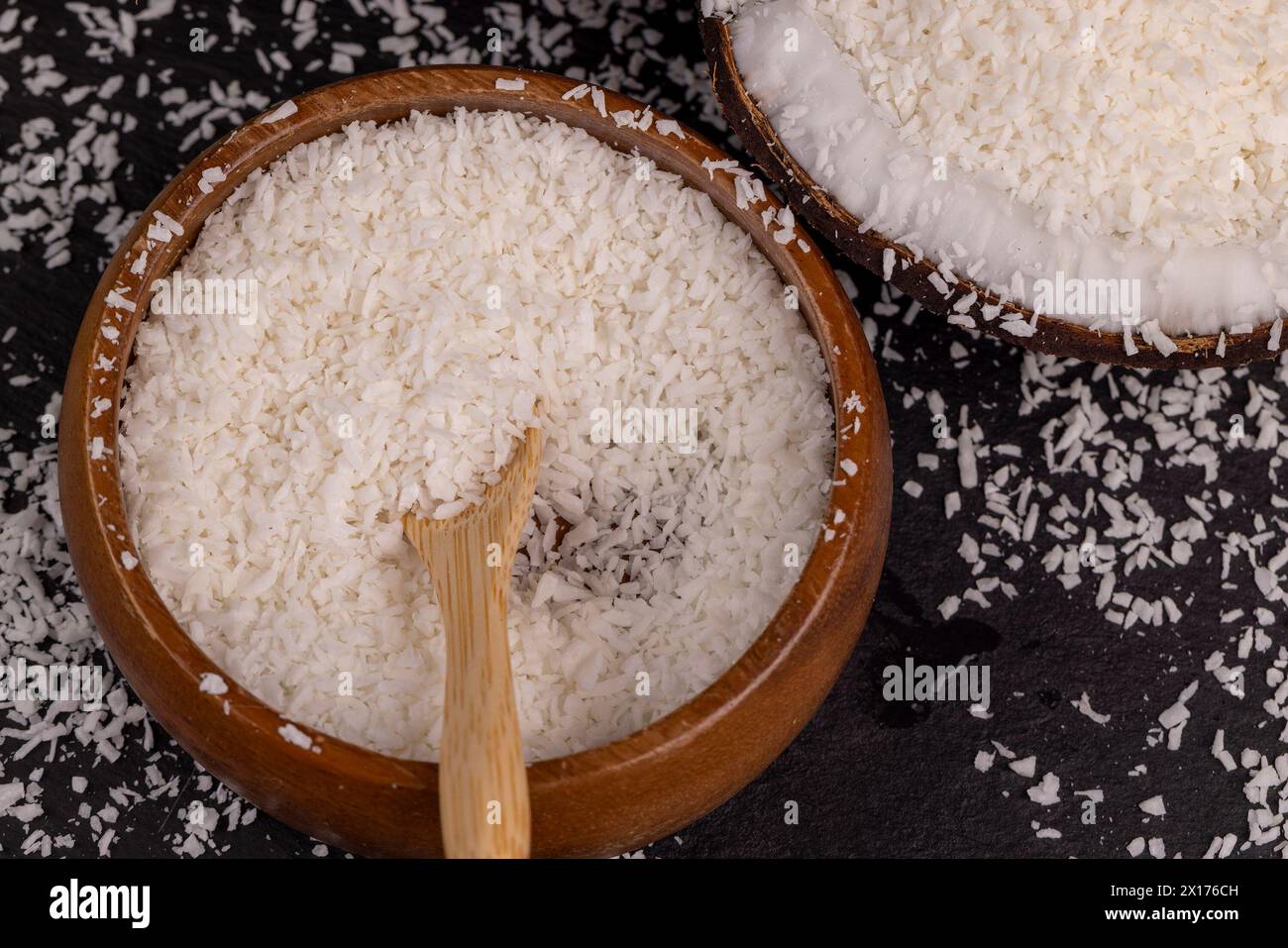 white coconut pulp and dried coconut flakes, a close-up of which is ...
