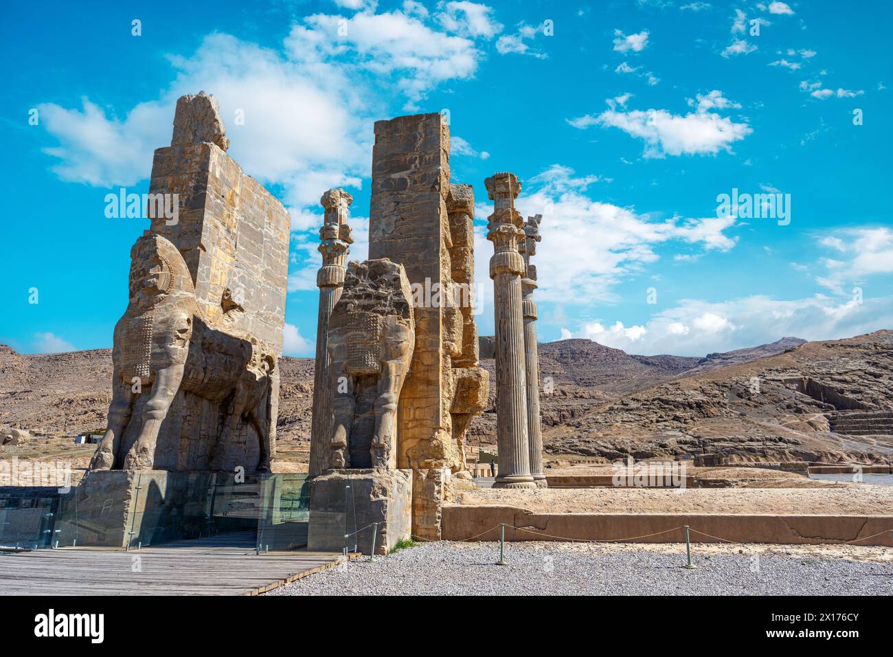 Imposing Lamassu statues stand tall, casting intricate shadows amidst ...